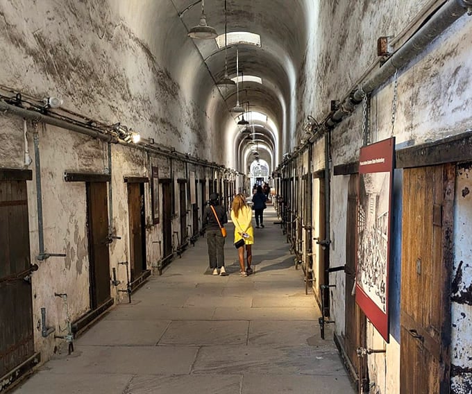 Modern visitors explore the same corridors where thousands of inmates once shuffled in complete isolation and silence.
