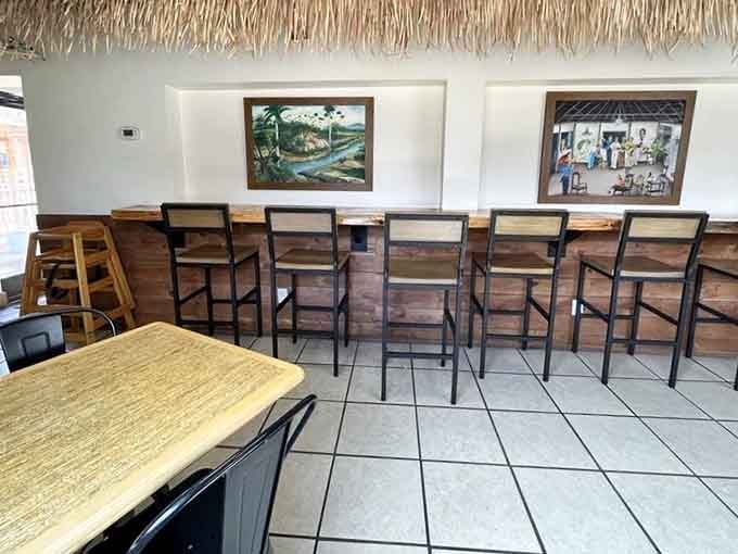 Bar seating under a thatched roof brings beach vibes to the Midwest, because why should geography limit your dreams?