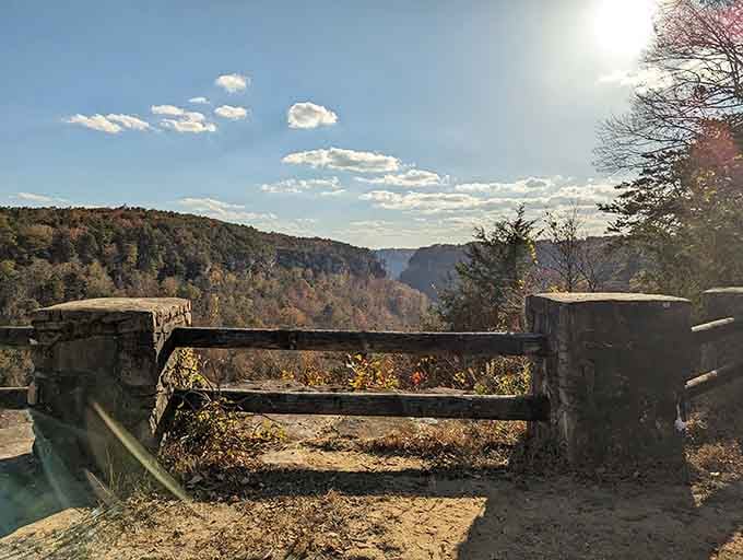 That weathered fence by the overlook has seen countless sunsets, offering a quiet spot to reflect and enjoy the view."