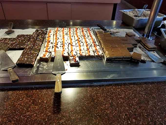 Chocolate desserts lined up like edible dominoes, daring you to remember you already ate three full plates.