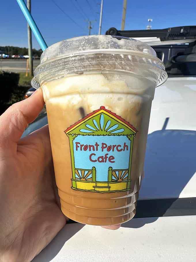 Iced coffee in a cheerful cup that tastes as good as it looks, perfect for beach days.