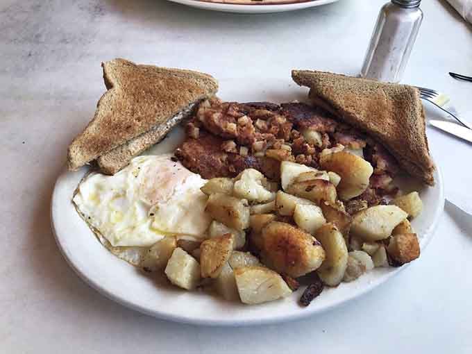 Corned beef hash with eggs that looks like comfort food decided to throw itself a welcome home party.