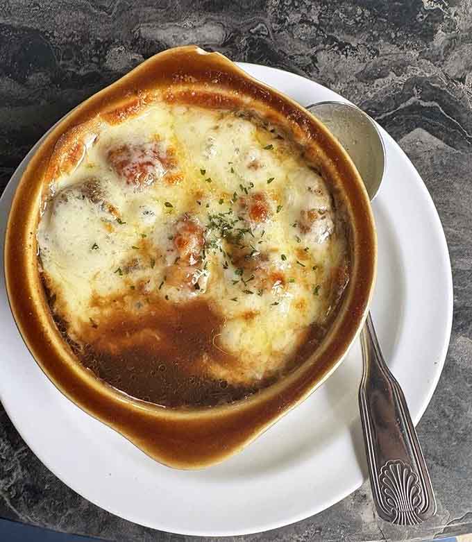 French onion soup bubbling with melted cheese in a proper crock is comfort in its most delicious form.