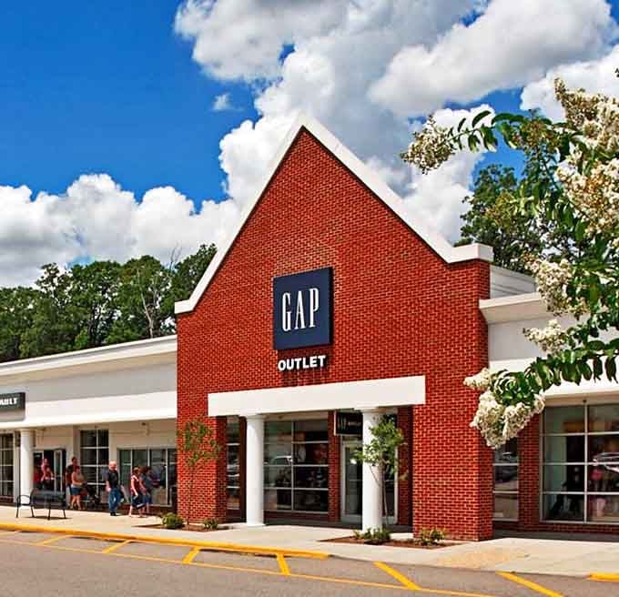 GAP's distinctive red brick facade stands out like a beacon for casual fashion seekers. Classic American style without the classic American prices.