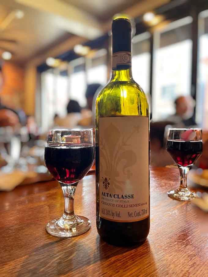 A bottle of Italian wine on the table means you're doing dinner right. The glasses are already half empty.