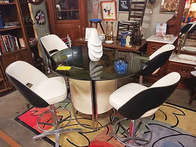 This sleek glass dining set with mod chairs is the conversation pit where the Jetsons would discuss their day.