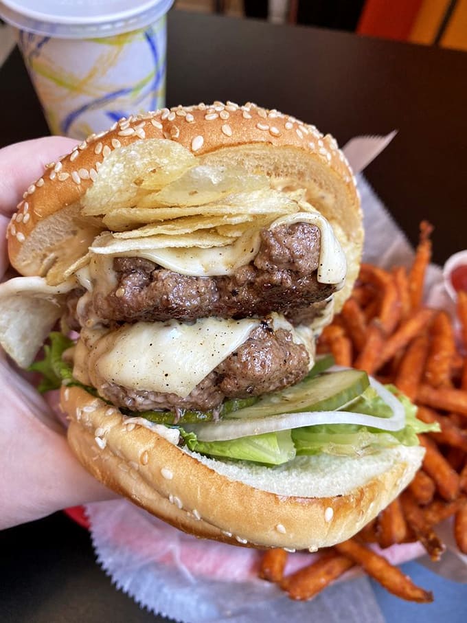 Potato chips IN the burger? Genius move that adds unexpected crunch and makes you wonder why everyone doesn't do this.