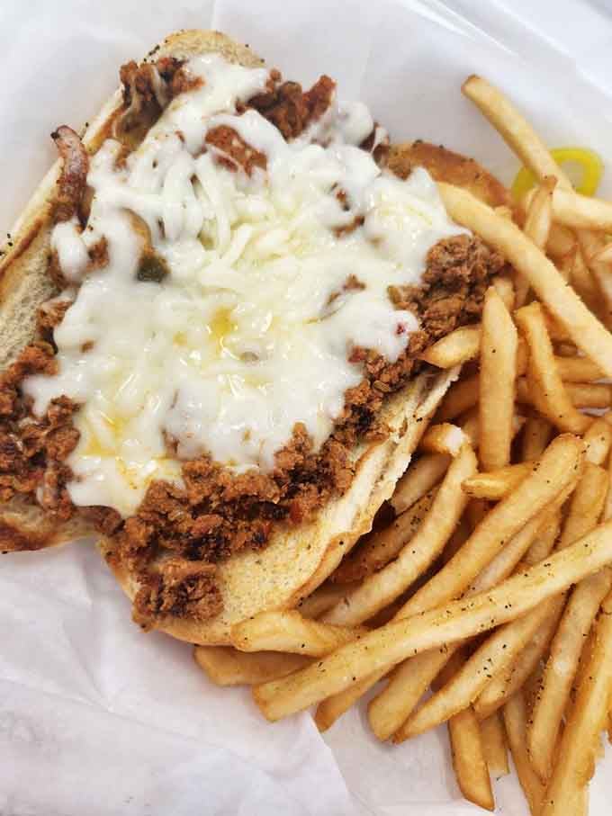 Melted cheese cascading over seasoned meat—this sandwich doesn't just satisfy hunger, it resolves existential doubts about the meaning of lunch.