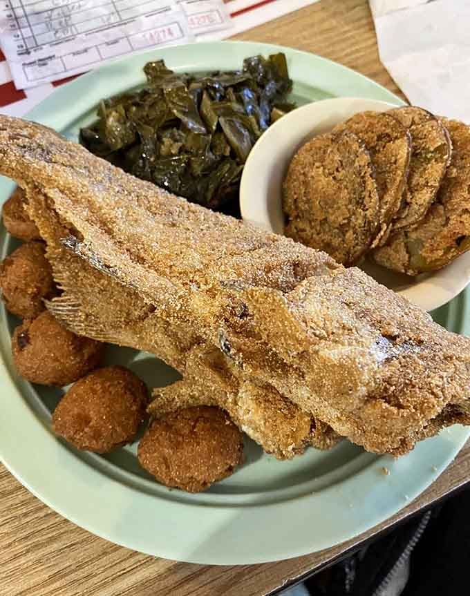 Crispy catfish and hush puppies alongside collard greens that have been cooked low and slow until they're absolutely perfect.