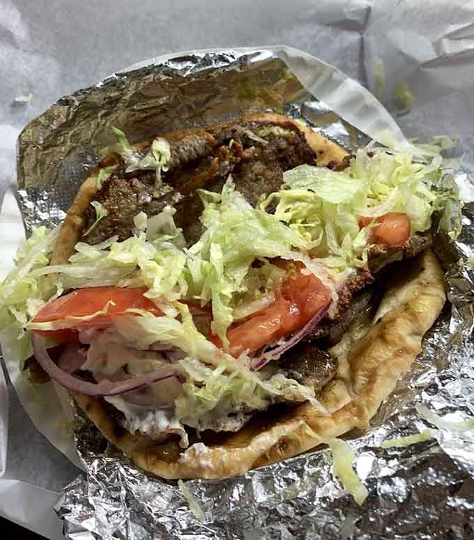 The gyro overflowing with meat, vegetables, and tzatziki sauce, proving Simco's mastery extends beyond the hot dog universe.