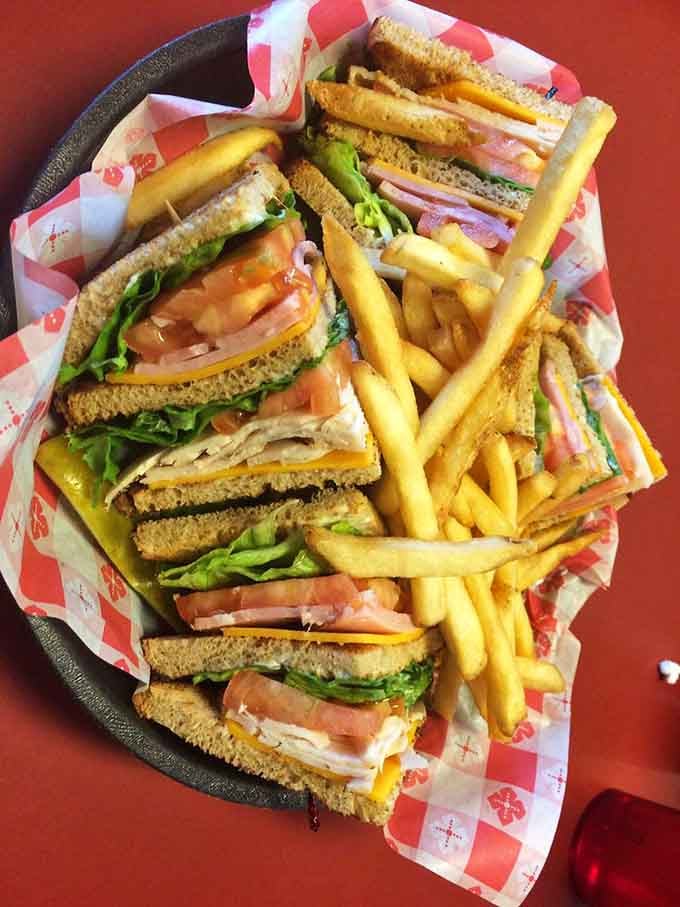 That towering turkey club sandwich stacked high with fresh ingredients makes lunchtime decisions incredibly easy for you.