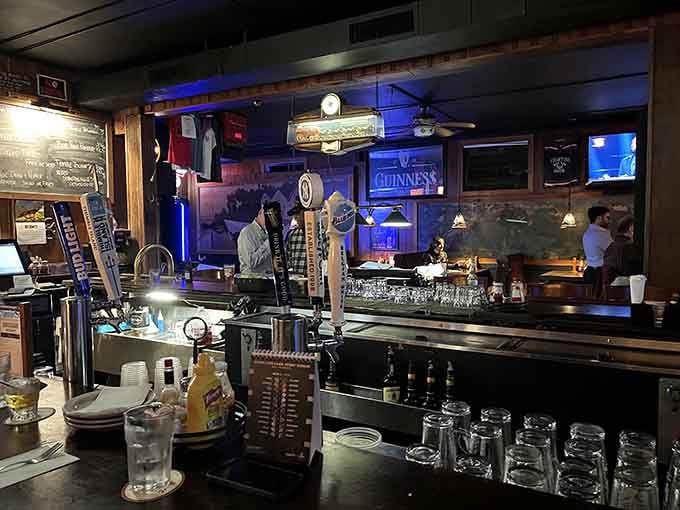 The bar stretches long and inviting, bottles lined up like soldiers, ready to serve the thirsty masses.