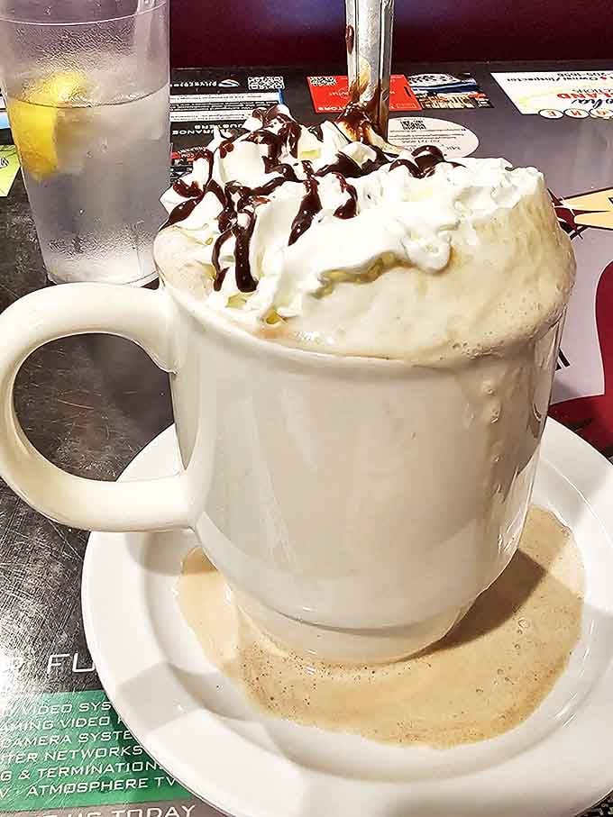 This isn't just hot chocolate&mdash;it's a mountain of whipped cream with chocolate drizzle that happens to have hot chocolate underneath.
