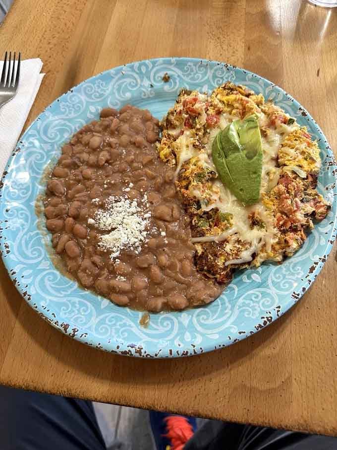 Huevos a la Mexicana: where scrambled eggs meet their destiny with tomatoes, onions, and beans. Breakfast that works at any hour of the day.