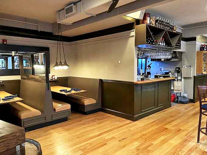 Comfortable booths and warm wood tones create intimate dining spaces, perfect for focusing on what really matters: that platter of smoked goodness heading your way.