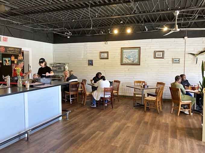 The bright, airy interior with its white brick walls creates the perfect canvas for focusing on what matters most: the food on your plate.