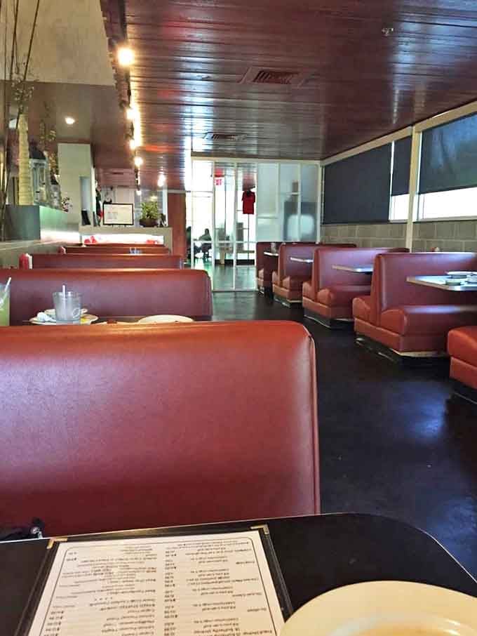 Red vinyl booths and wood-paneled ceilings create that classic "everybody knows your name" vibe that chain restaurants try desperately to replicate.