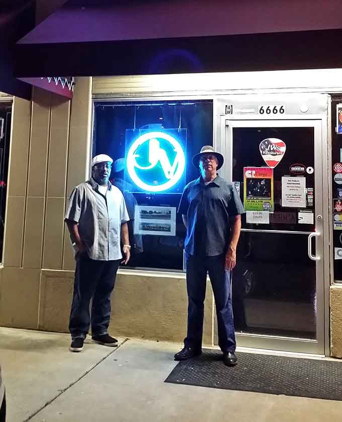 Standing proud outside JV's, these folks know they've found something special worth celebrating and sharing with everyone.