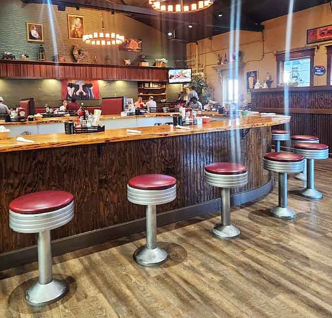Classic diner counter seating with retro stools where you can watch the breakfast magic happen up close.
