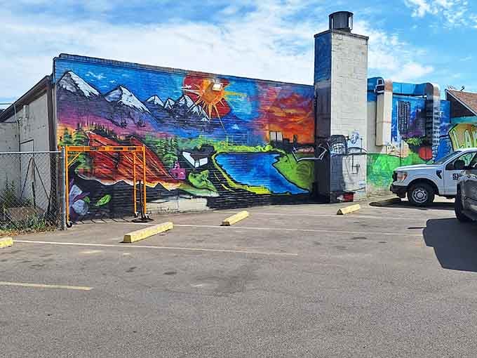 This spectacular mural transforms a parking lot wall into a Colorado-themed masterpiece worth the drive alone.