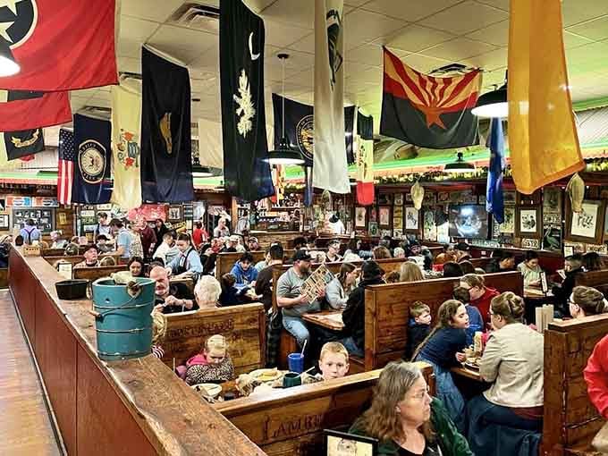 The packed dining room buzzes with laughter, flying rolls, and the sound of pure American joy.