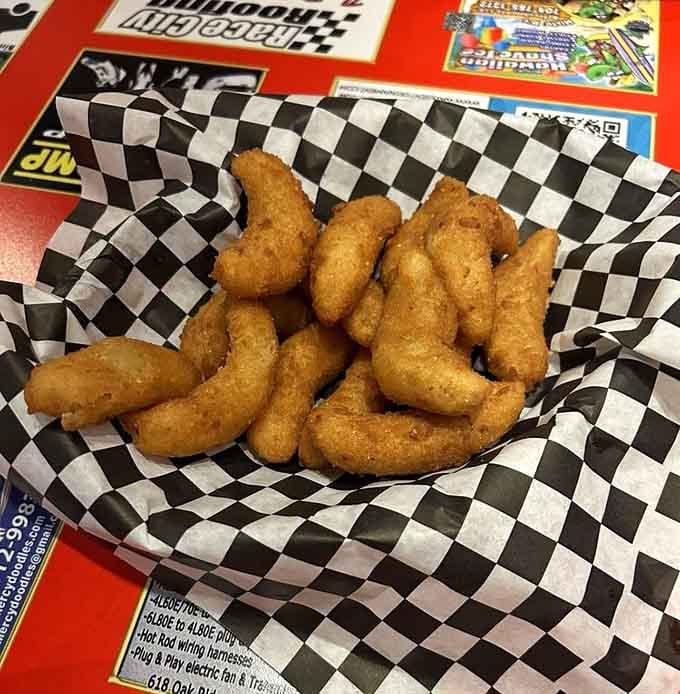 Hushpuppies so perfectly golden they could win a beauty pageant, if beauty pageants judged fried cornmeal balls properly.