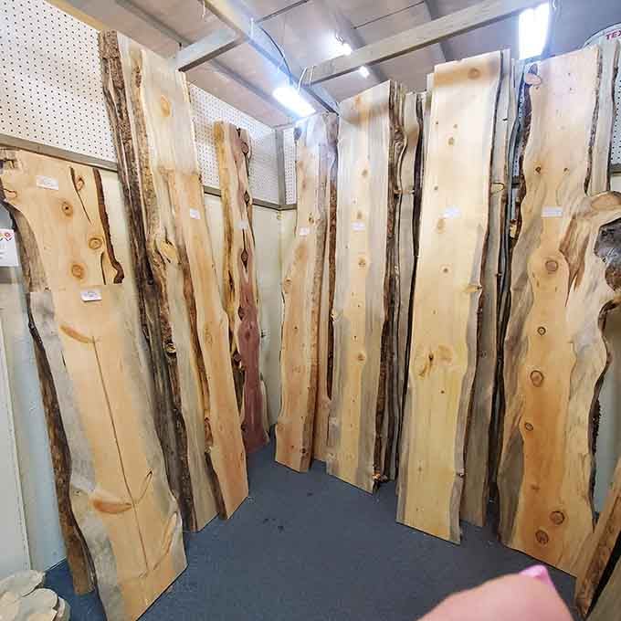 Live edge wood slabs waiting to become the conversation-starting table you didn't know you absolutely needed.