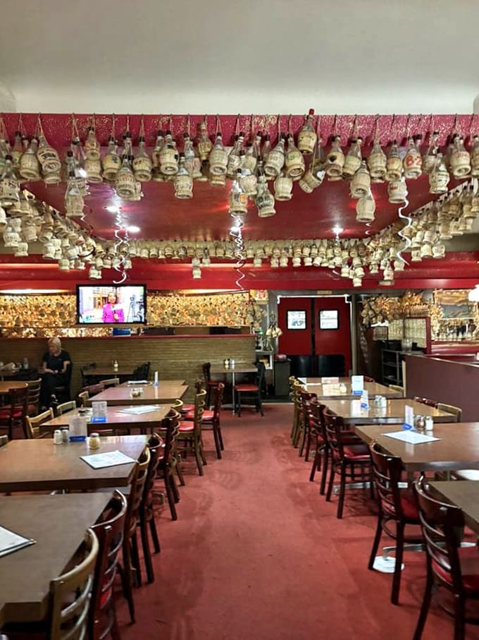 Rows of tables await hungry diners beneath decorative touches that have witnessed decades of happy meals and conversations.