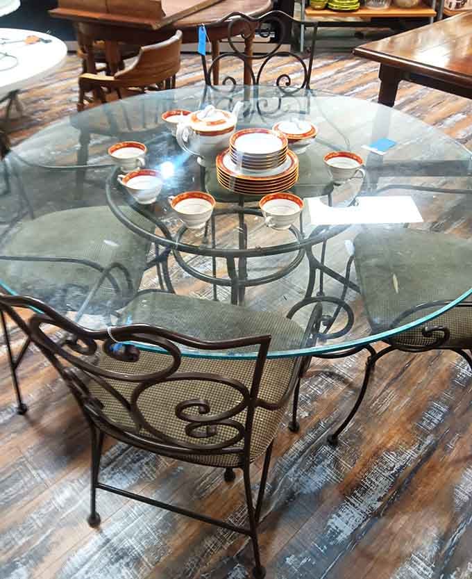 Glass-top dining set with decorative chairs that looks fancier than half the furniture stores charging ten times the price.