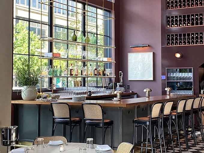 A bar that takes its wine storage as seriously as its book curation, with bottles displayed like literary awards.