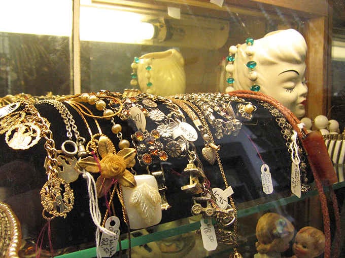 Vintage necklaces draped across velvet like they're waiting for their close-up in a Hitchcock film, mysterious and impossibly glamorous.
