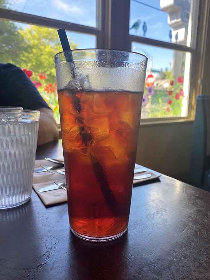 Iced tea so tall it could double as a small aquarium, refreshing and ready for refills.
