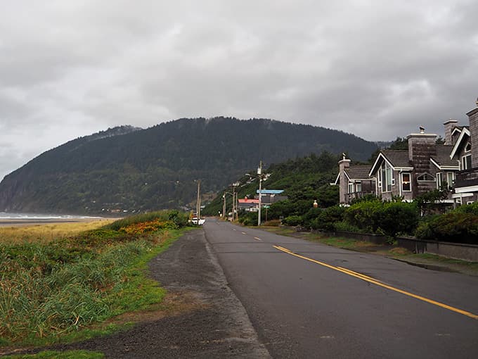 Vintage beach cottages nestle against coastal hills, looking exactly like the getaway homes you've been dreaming about nightly.