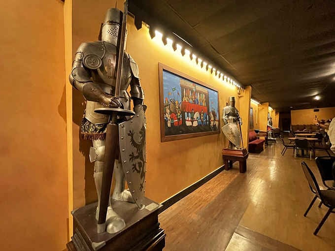 Suits of armor stand guard in the hallways, silently judging your modern footwear choices with medieval disdain.