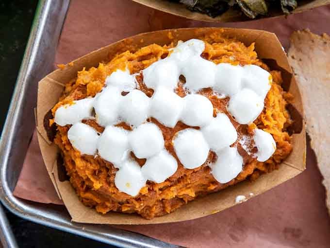 Sweet potato souffl&eacute; topped with marshmallows is basically dessert pretending to be a side dish, and nobody's complaining about it.