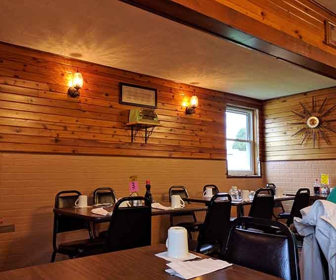 Warm wood paneling and cozy booth seating create the kind of atmosphere where time slows down over coffee.