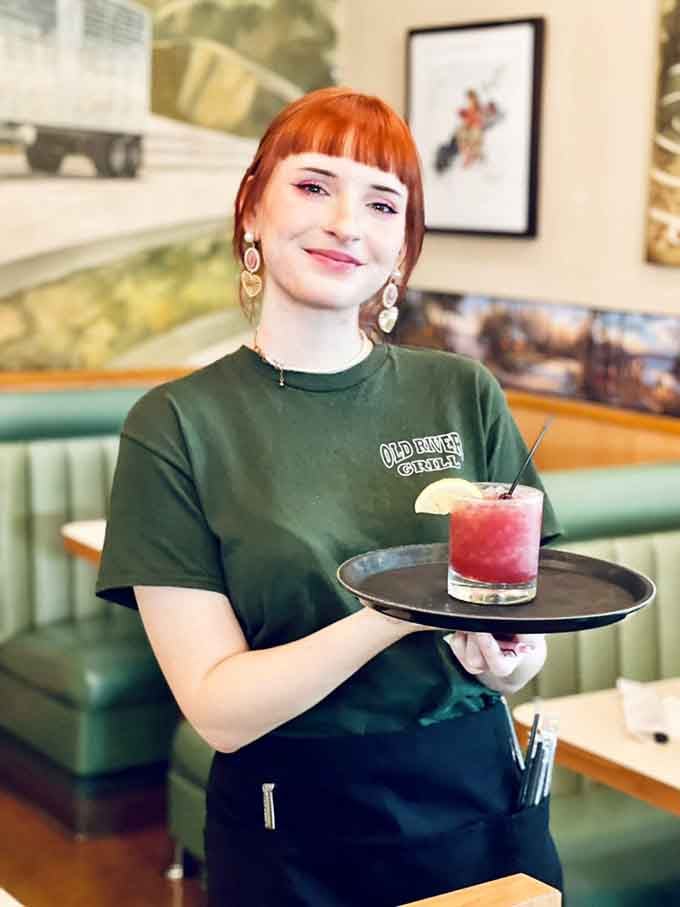 That smile says she genuinely enjoys bringing you food, which is rarer than you'd think in this business.