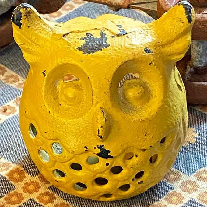 A cheerful yellow owl candle holder that's equal parts whimsical and "why don't I own this already?"
