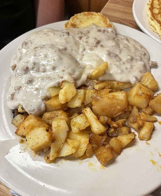 That open-faced sandwich drowning in gravy is comfort food at its finest, no apologies necessary for the inevitable food coma.
