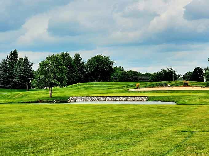 The pristine golf course stretches across rolling green terrain, offering peaceful views that make you forget about your terrible putting skills temporarily.