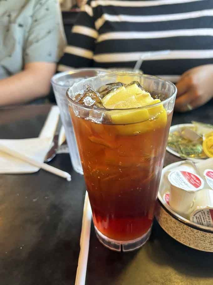 Sweet tea with lemon in a tall glass is the Southern refreshment that makes every meal feel like summer.