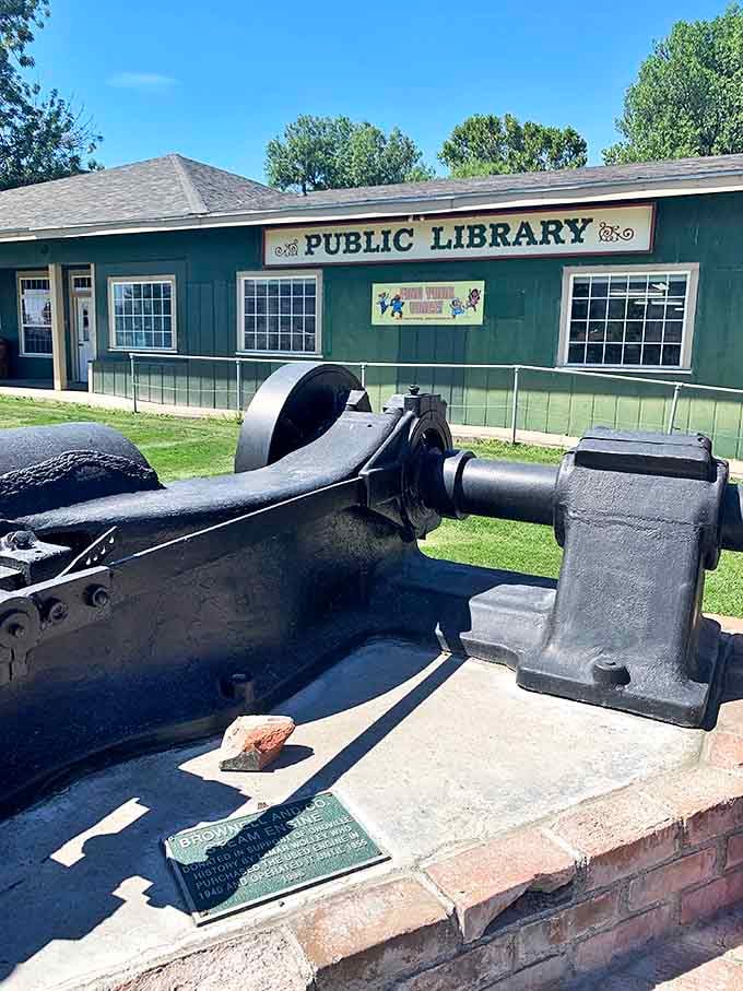 The public library stands guard over knowledge while a piece of industrial history reminds visitors that Oroville's story was written with both books and hard labor.
