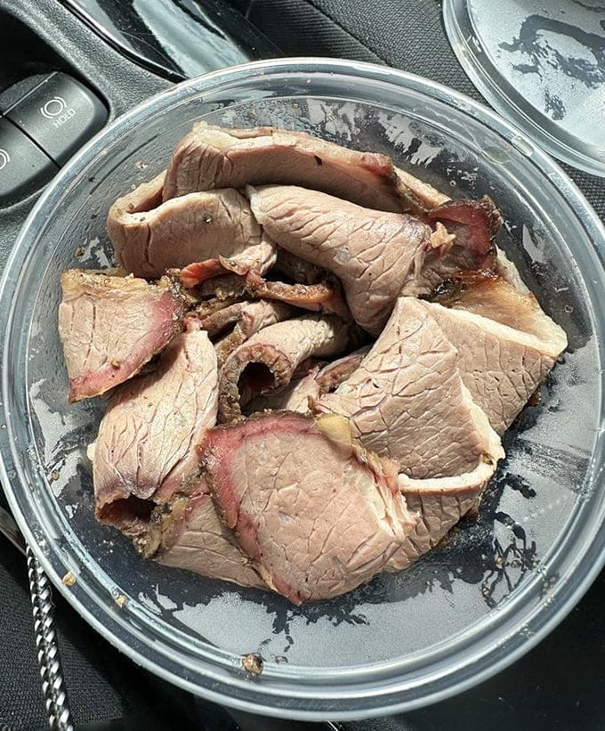 Sliced brisket with a smoke ring that beautiful deserves to be framed before being devoured completely.