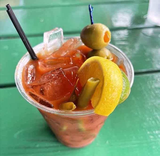 A Bloody Mary garnished like it's trying to be a meal itself, which honestly isn't the worst strategy here.