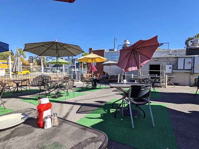 Outdoor patio seating under colorful umbrellas for those perfect Colorado weather days.