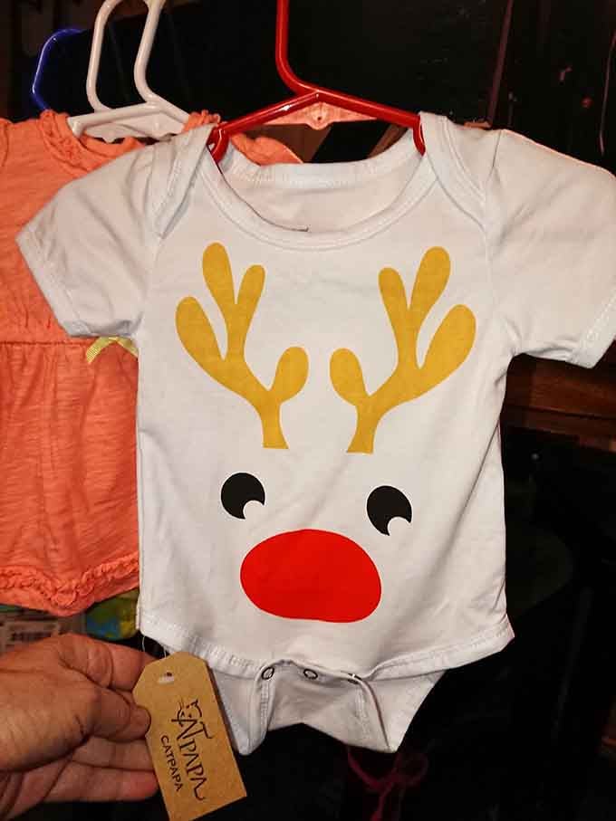Baby's first Christmas outfit, complete with Rudolph, because adorable holiday photos require proper preparation and planning.
