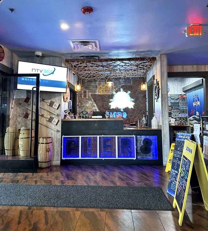 The blue-lit reception area with rustic touches sets a welcoming tone before your seafood adventure even begins.