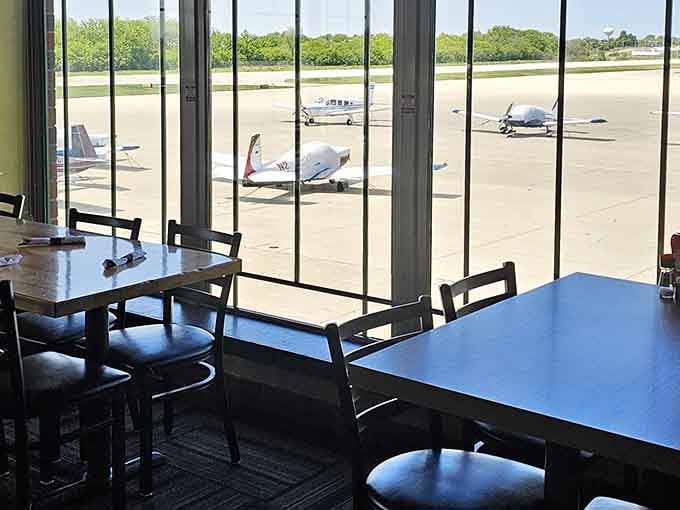 Window seats offer front-row views of the tarmac, where the real entertainment takes off and lands all day long.