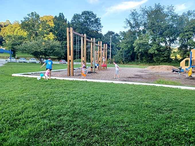 Modern playgrounds meet timeless mountain scenery, where kids burn energy while parents enjoy the backdrop.