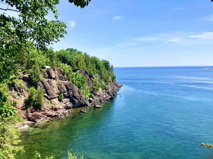 Red cliffs plunging into turquoise waters create color combinations that shouldn't work together but absolutely do spectacularly.